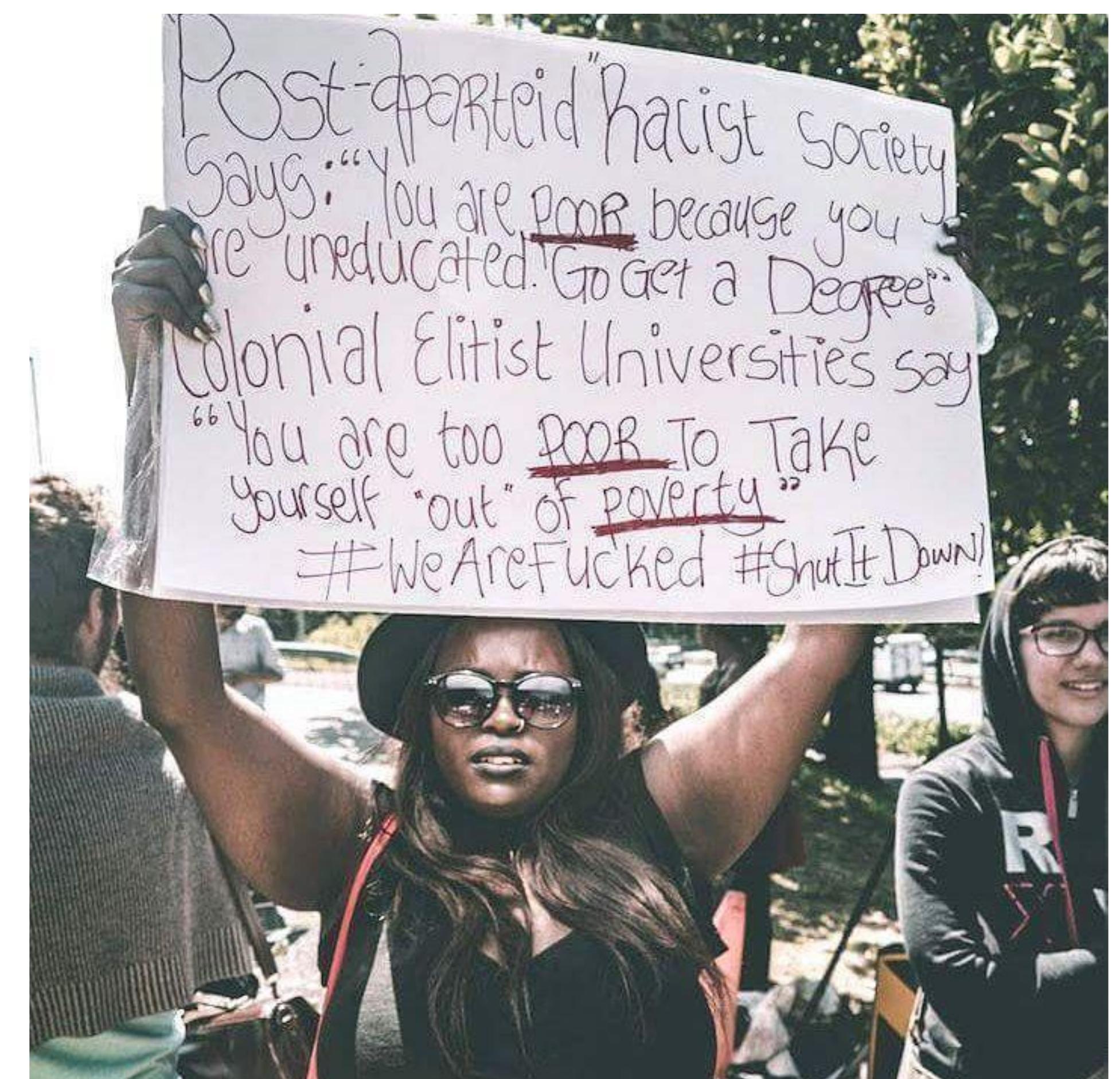 Fees must fall poster saying, ‘post-apartheid society says: