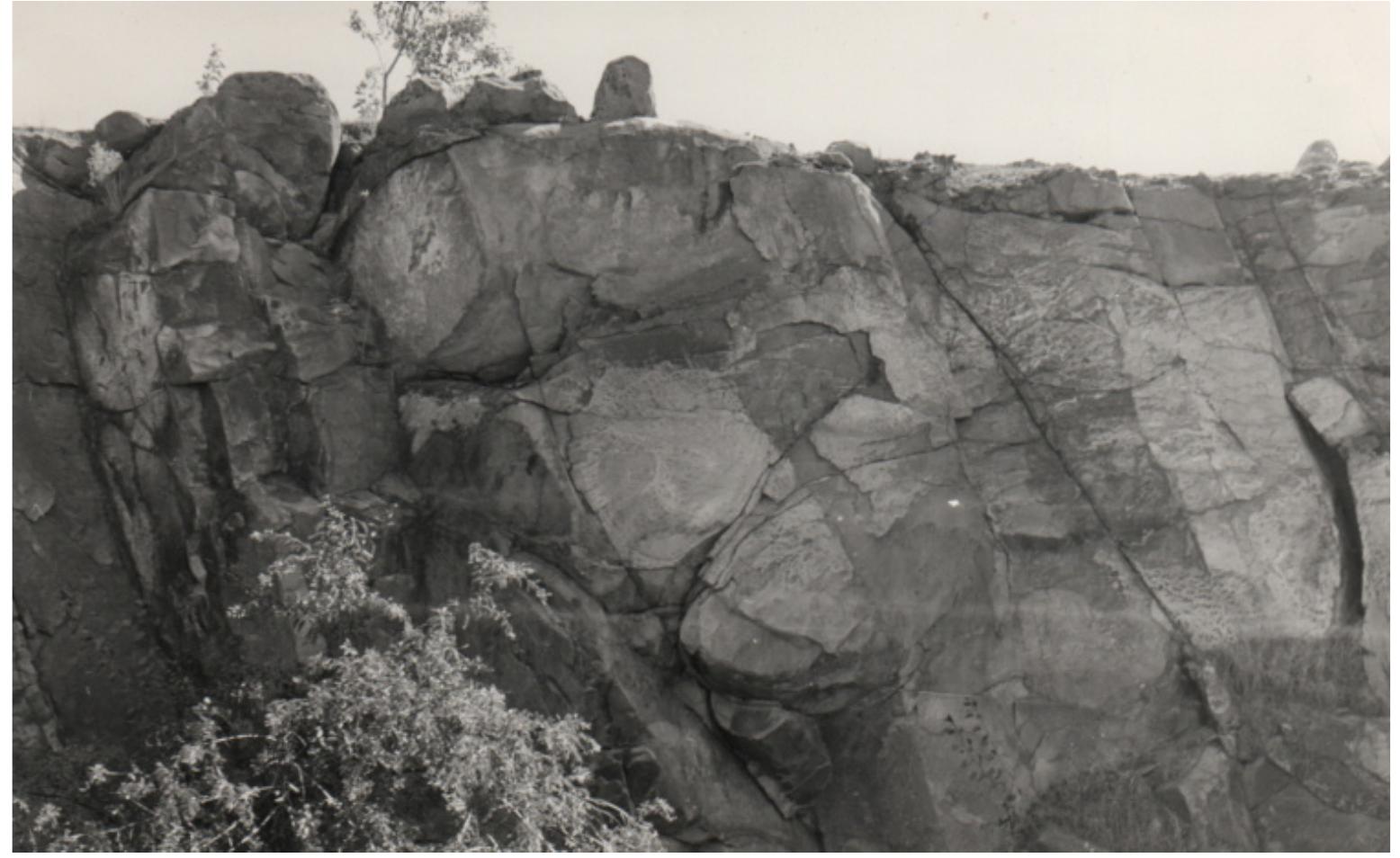 (a) vertical zone of slivers of laminated granite adjacent