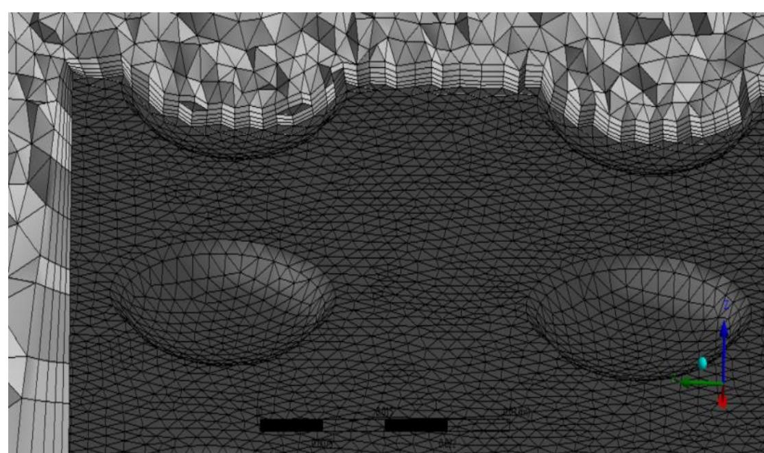 Cut section view of enhanced refinement of mesh near dimples