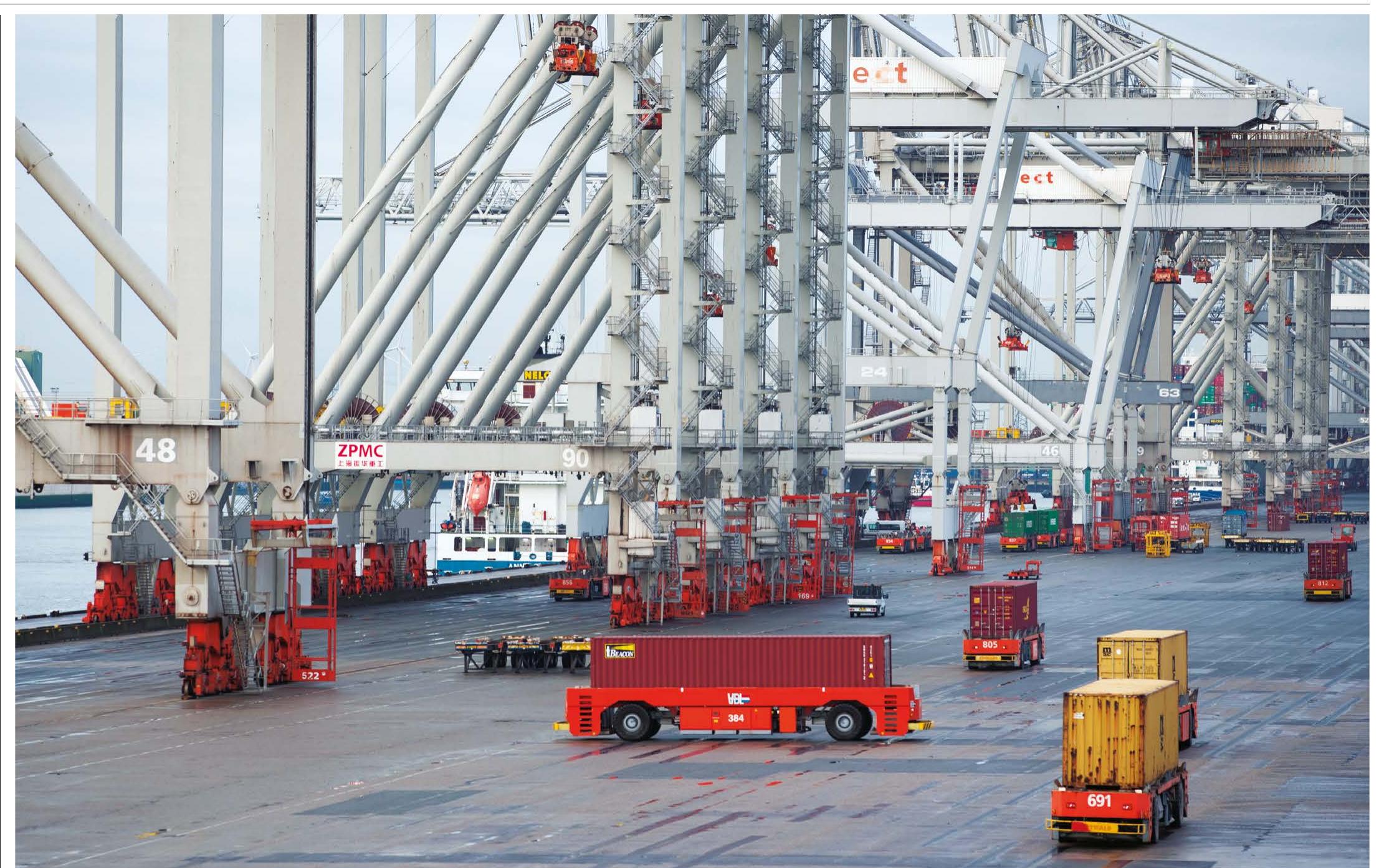 Automated guided vehicles move shipping containers in the