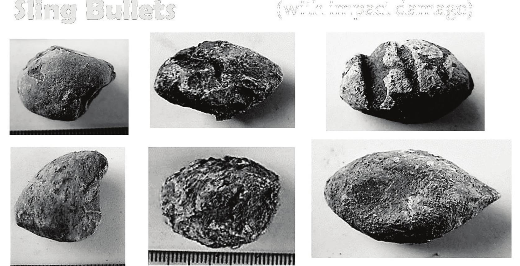 Lead sling bullets with signs of impact damage.