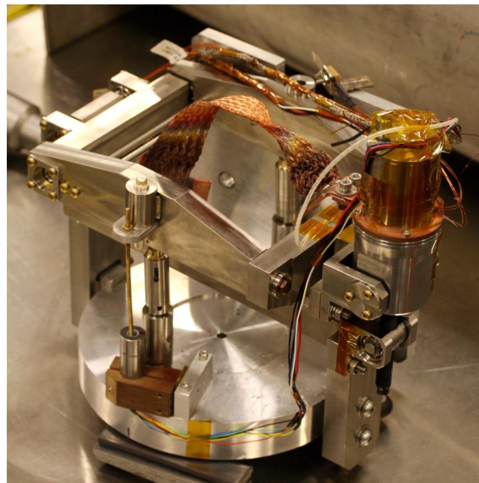 Tuner assembly attached to aluminium base plate and spring