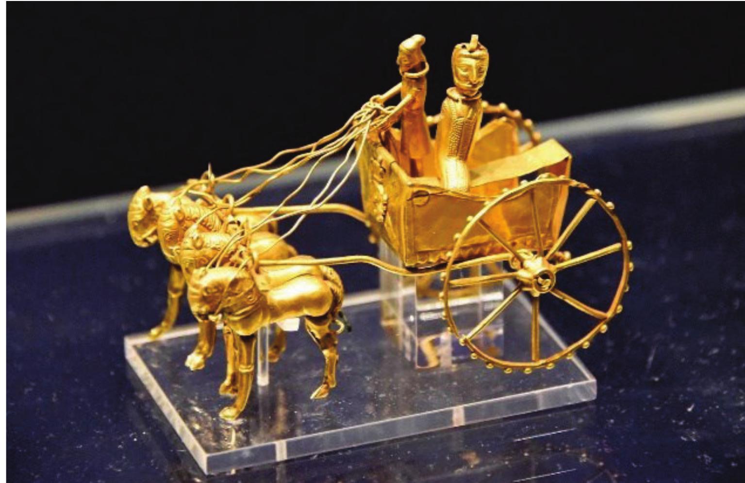 - model of gold chariot drawn by four horses abreast: the