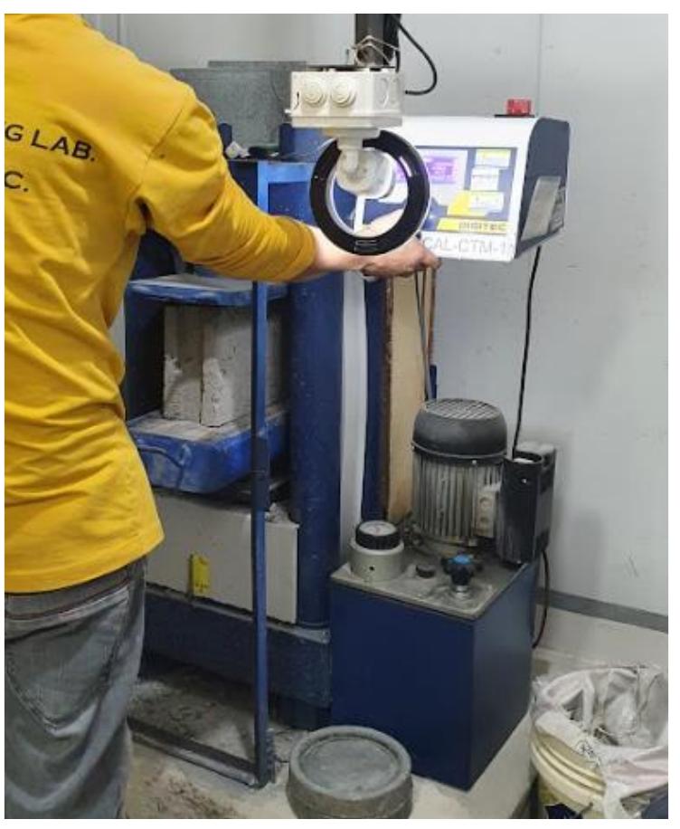 Machine. figure 22. chb undergoing compressive strength test