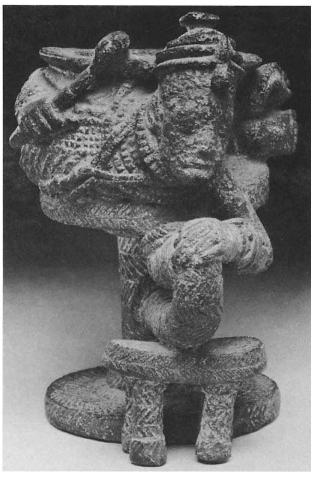 11 ife brass figure of a king holding a scepter, curled