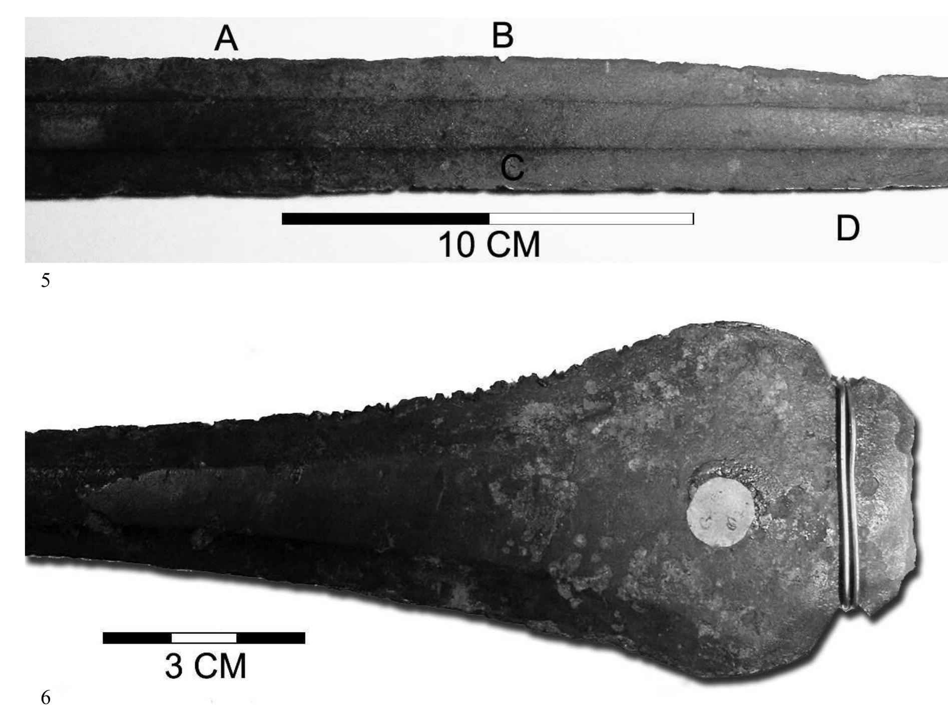 Edge damage on long and narrow irish grip-plate sword