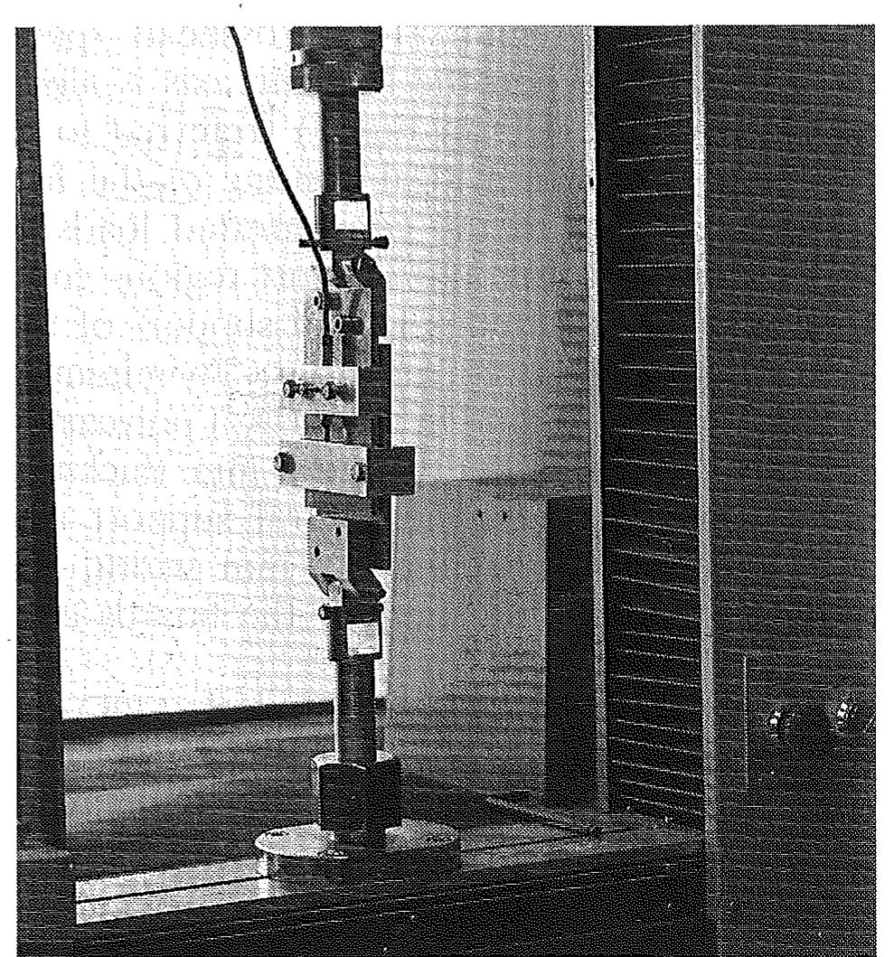 Block shear test fixture mounted in the test frame. figure
