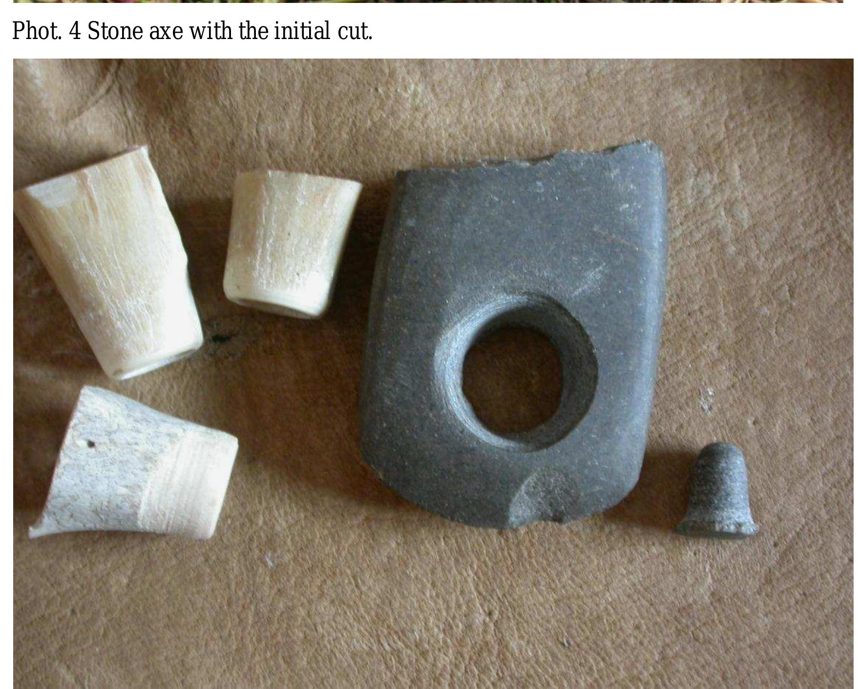 Drilling through stone axes.