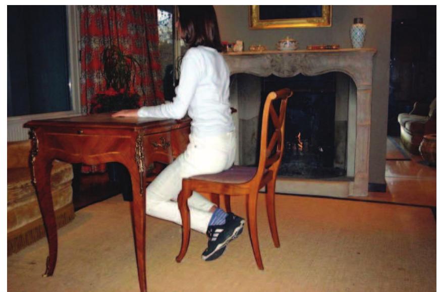 Usual sitting position for writing and using the computer.