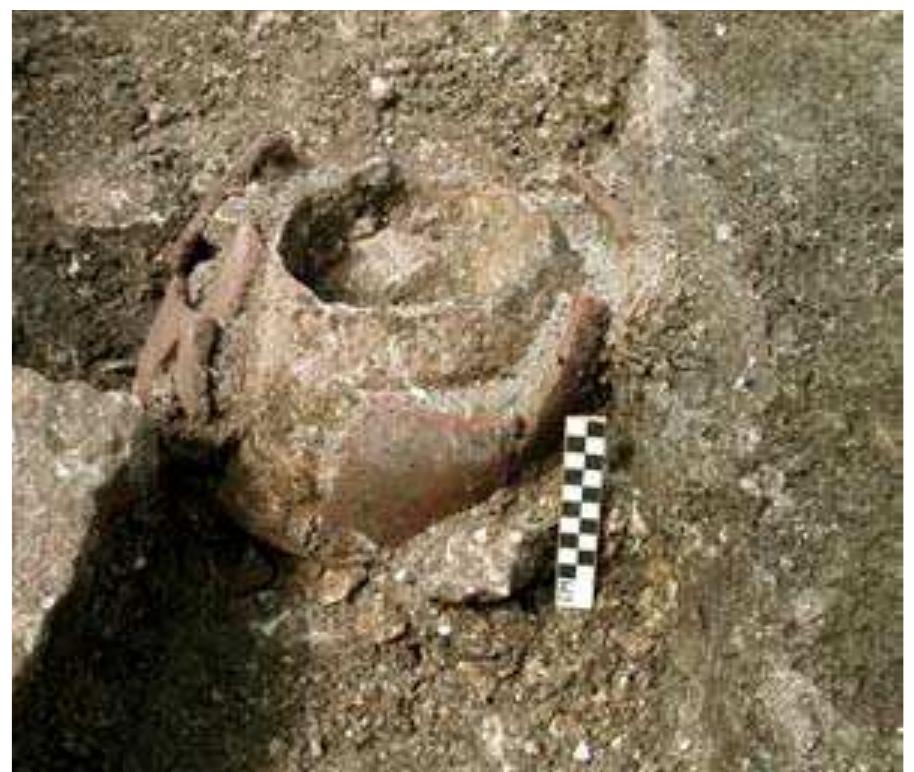 -11: fragmentary pottery jar full of set gypsum plaster,