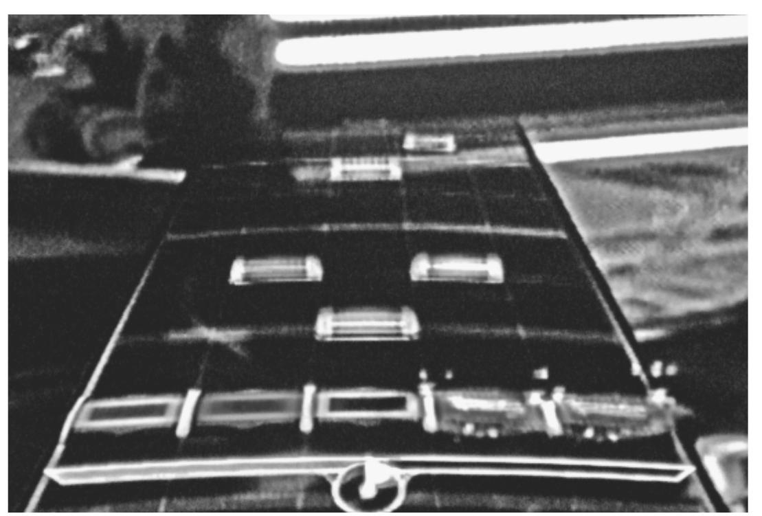 Example 8.2. scrolling guitar notation