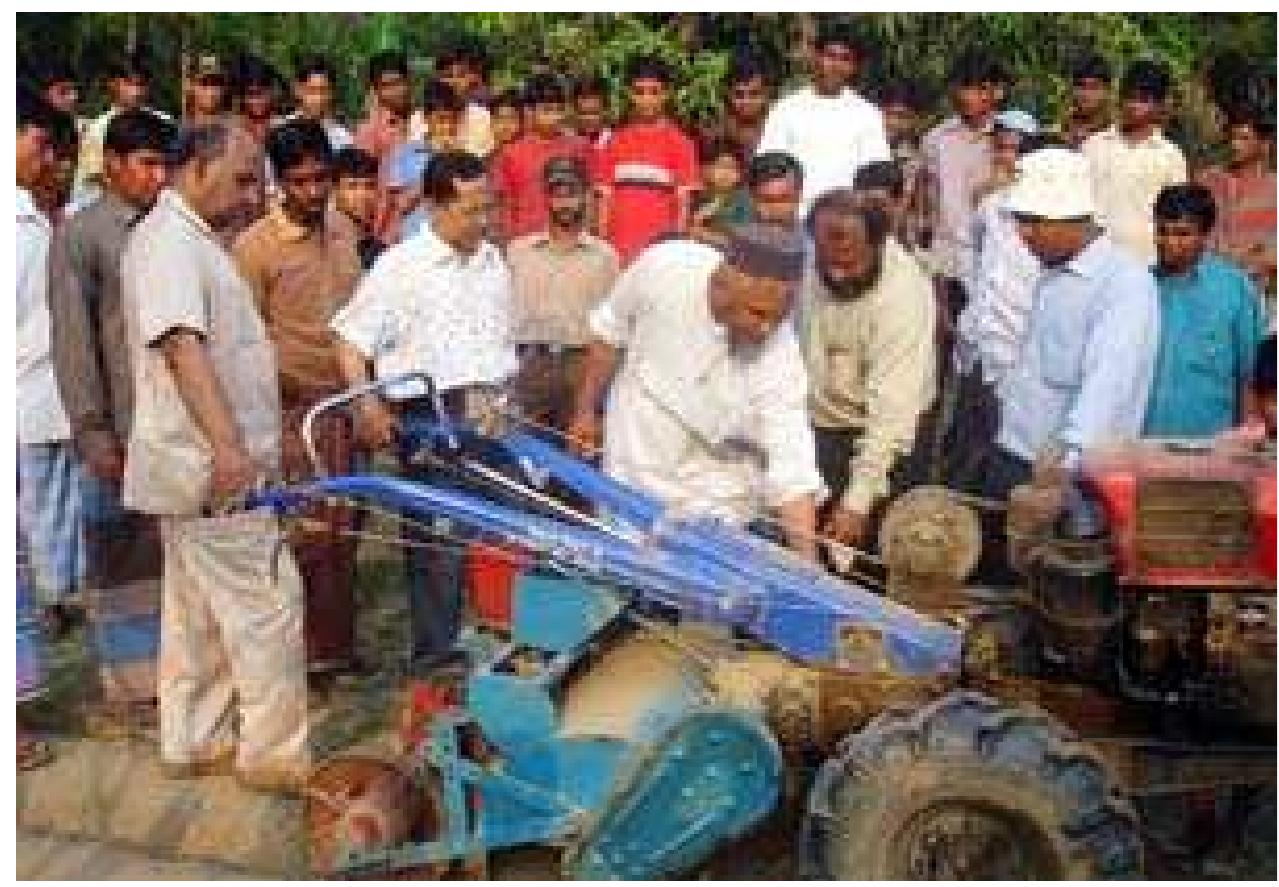 2. new bed former-planter attached to a power tiller being