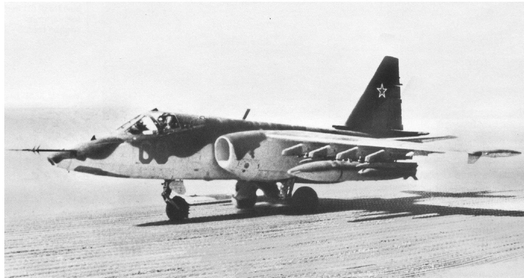 Su-25 ona dirt airstrip covered with temporary metal strips: