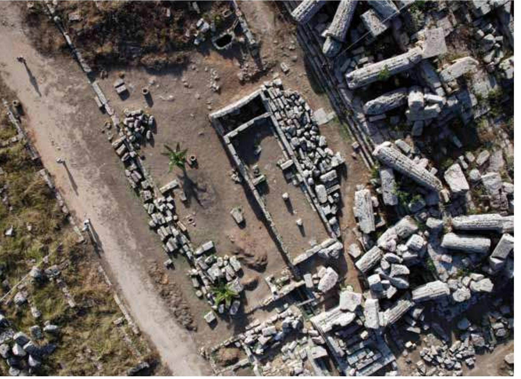 Above an aerial view of temple r, believed to bea temple to