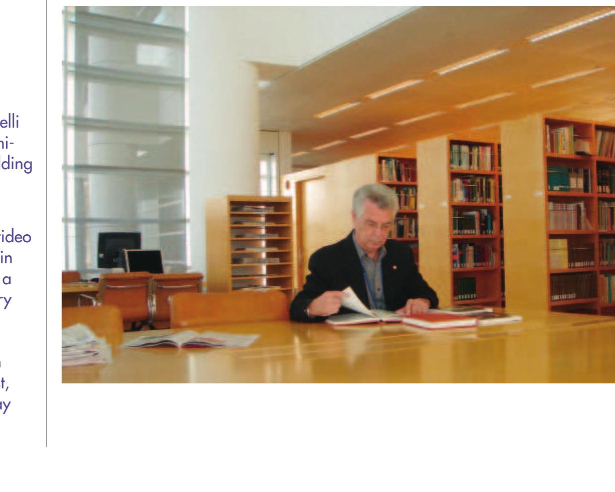 Patron using materials from the information center at the