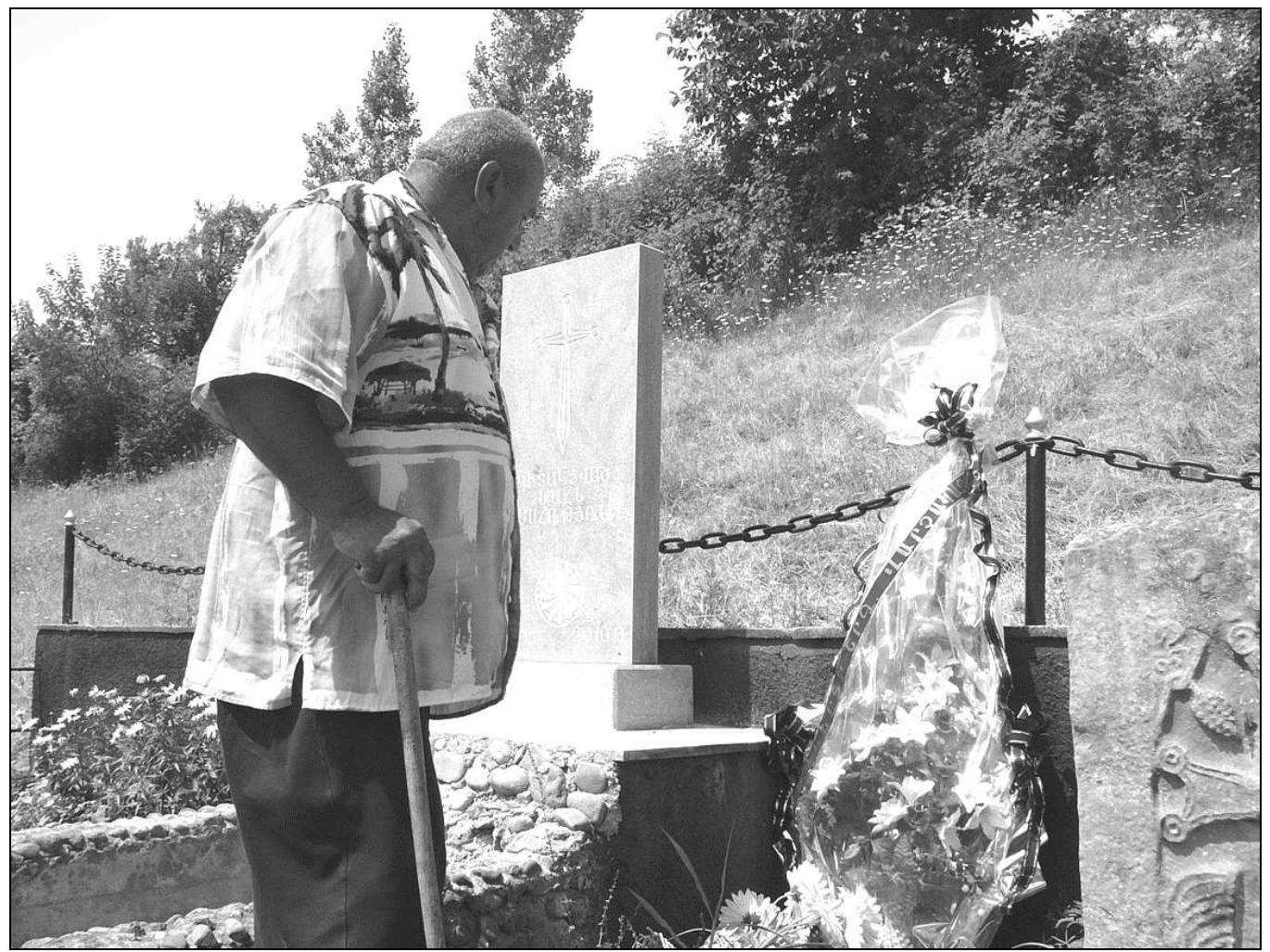 Hovtashen, with a villager visiting the monument (photo by