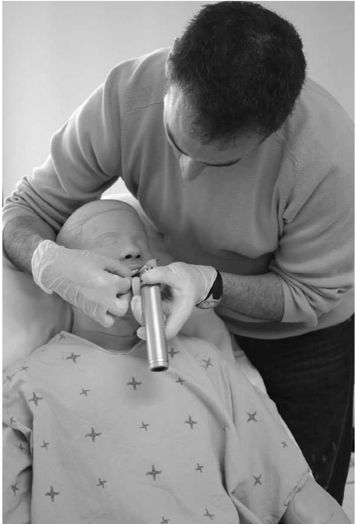 -7. sitting position direct laryngoscopy. note