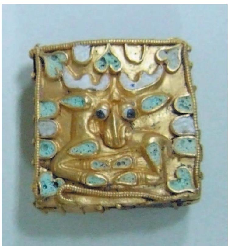 Figure 6 - A Han-dated ‘hydra’-type nephrite scabbard slide