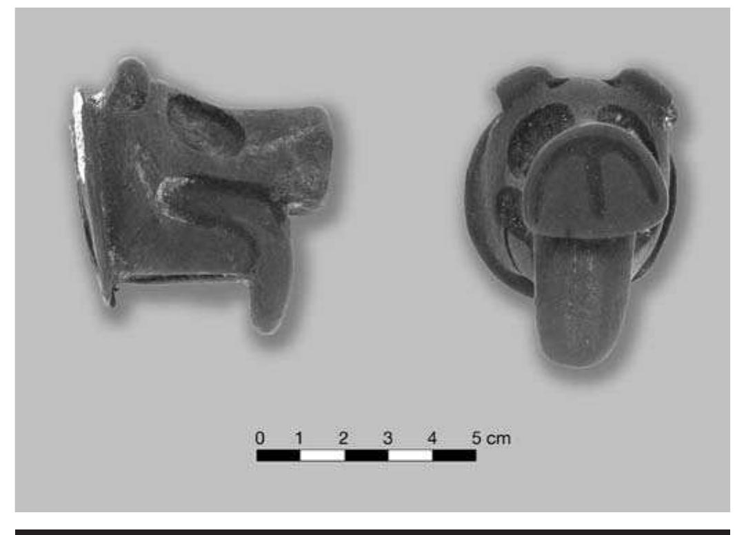 8. canine wooden effigy earspools, side and frontal views
