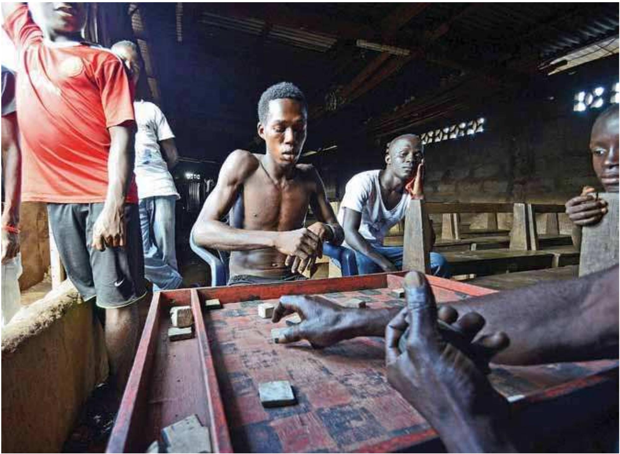 Killing time in kroo bay slum, freetown, sierra leone where