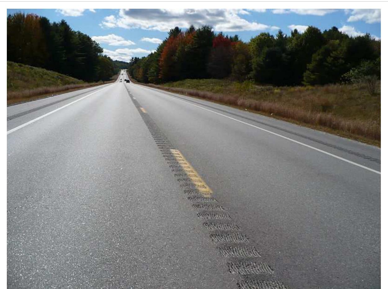 A road through hilly terrain with vertical curves in new
