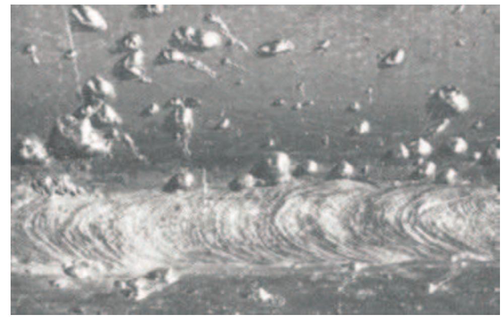 Description: globules of weld or filler metal expelled