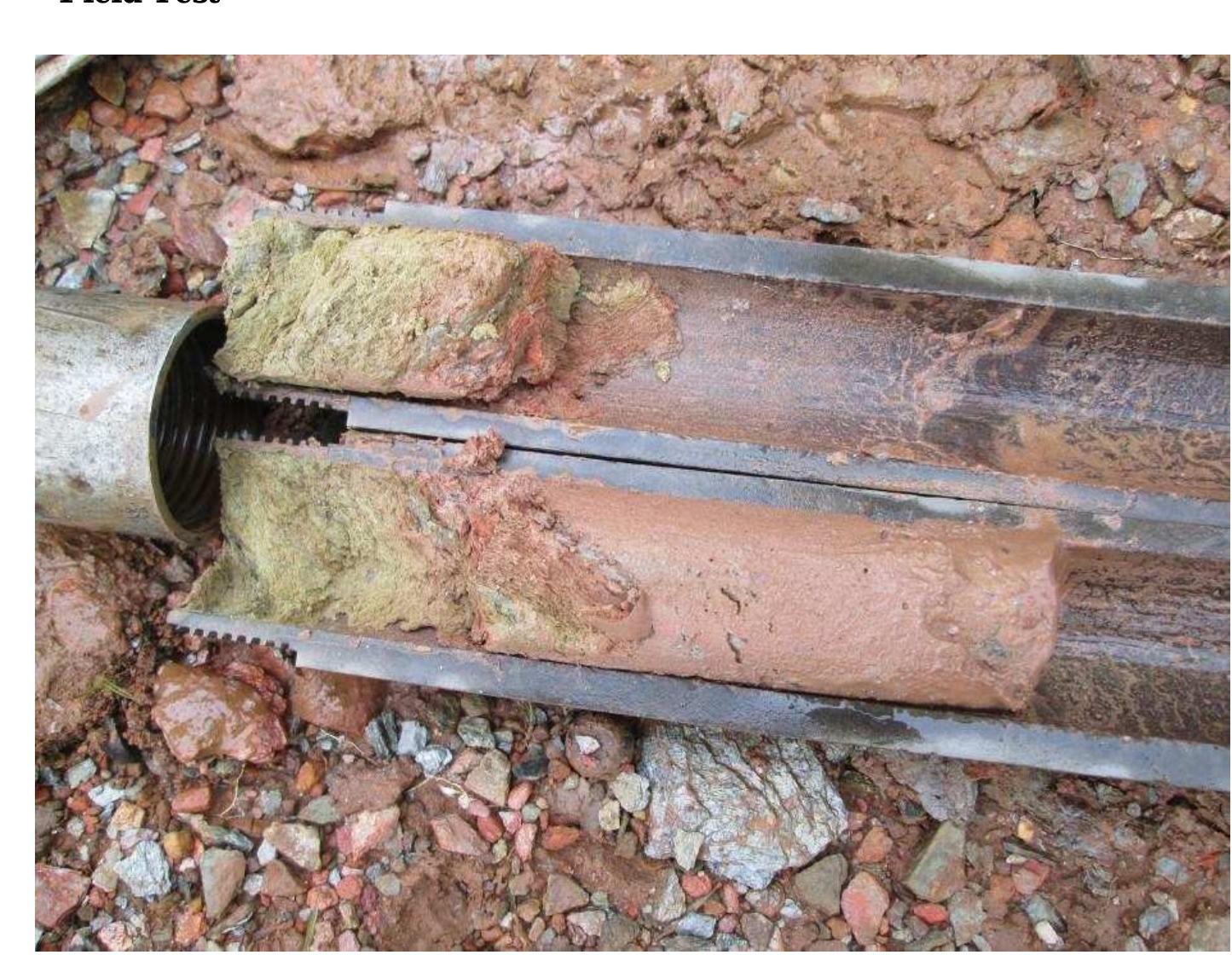 Highly weathered phyllitic rock sample on split spooner