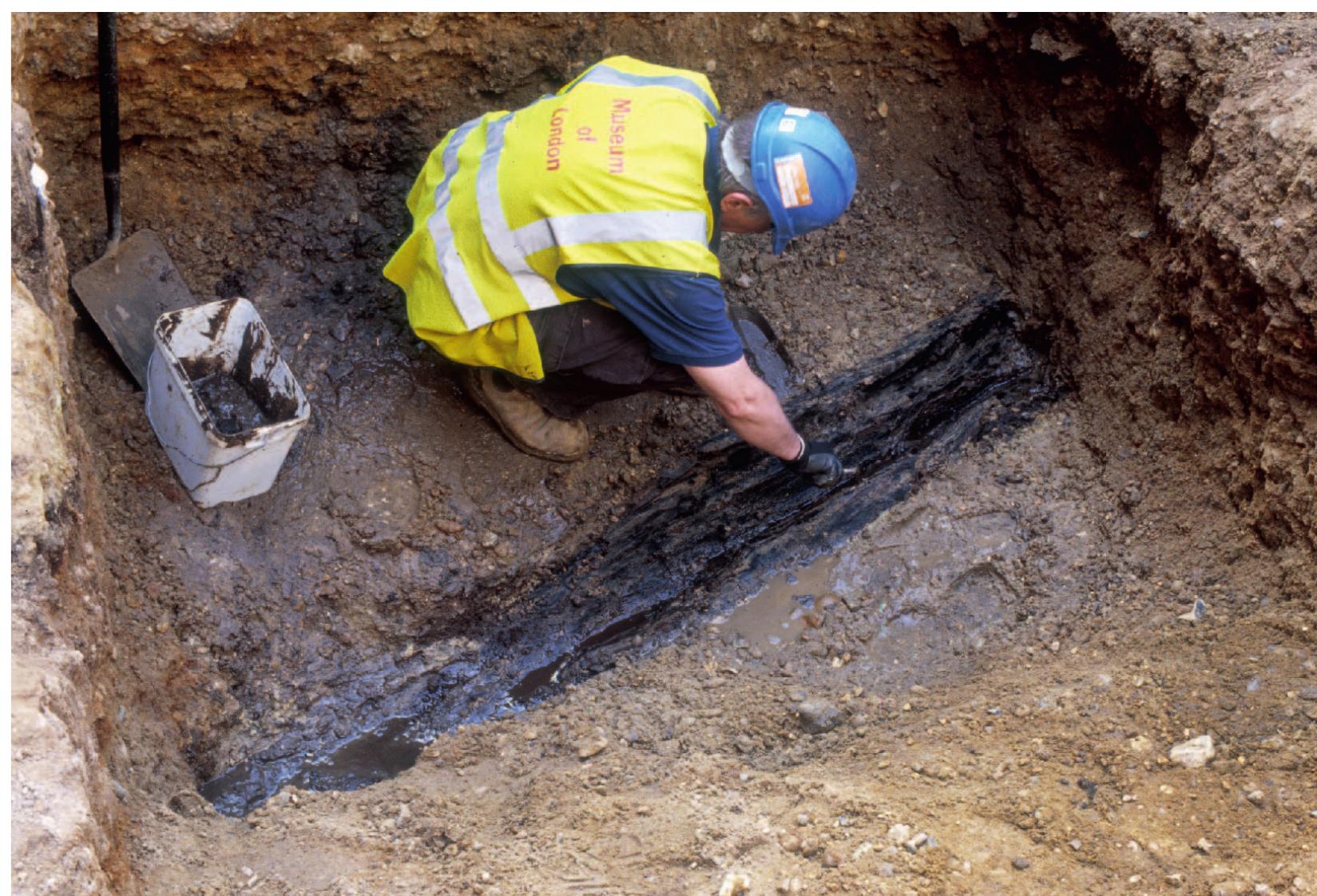 Structure 2 under excavation, showing the timber drain in