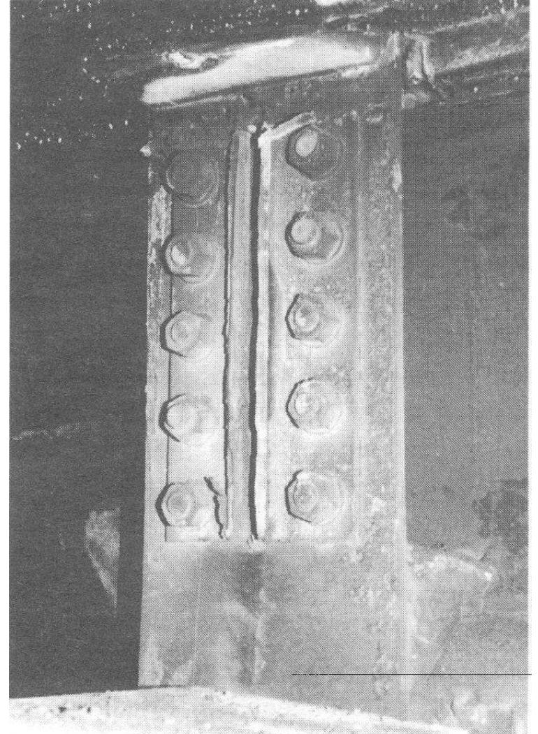 Connection failure at end of buckled beam.