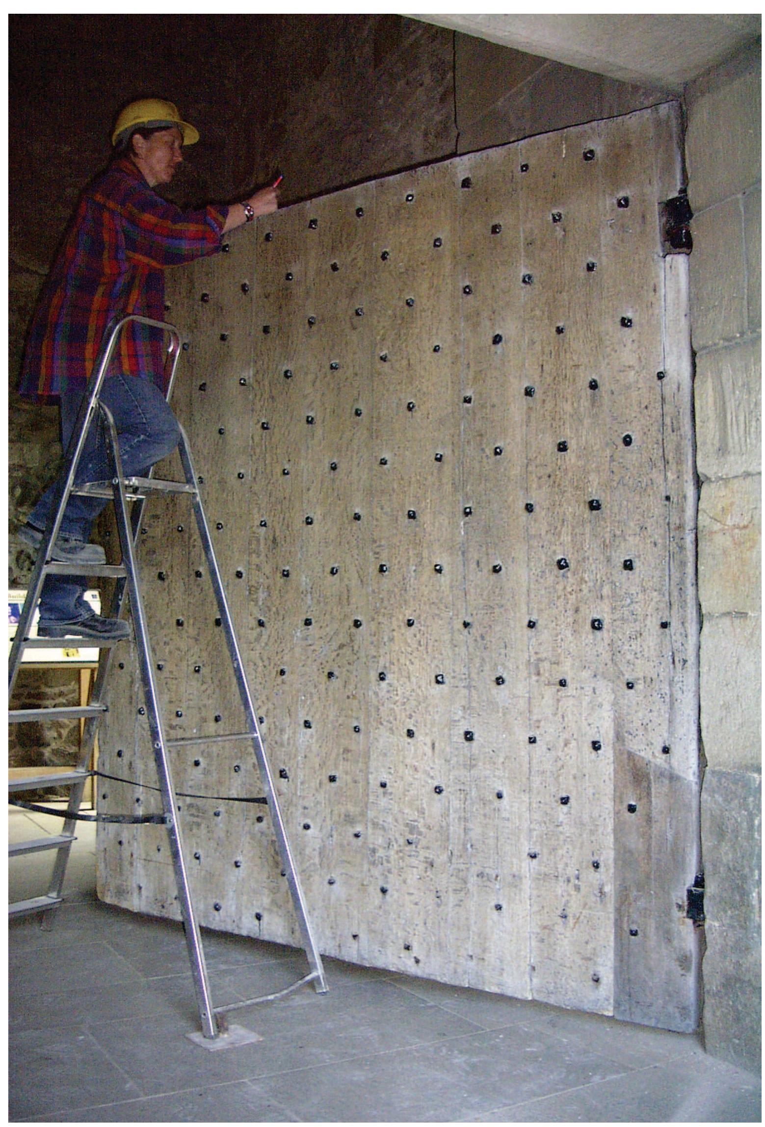 Llus 6 sampling in progress on the massive oak door leading