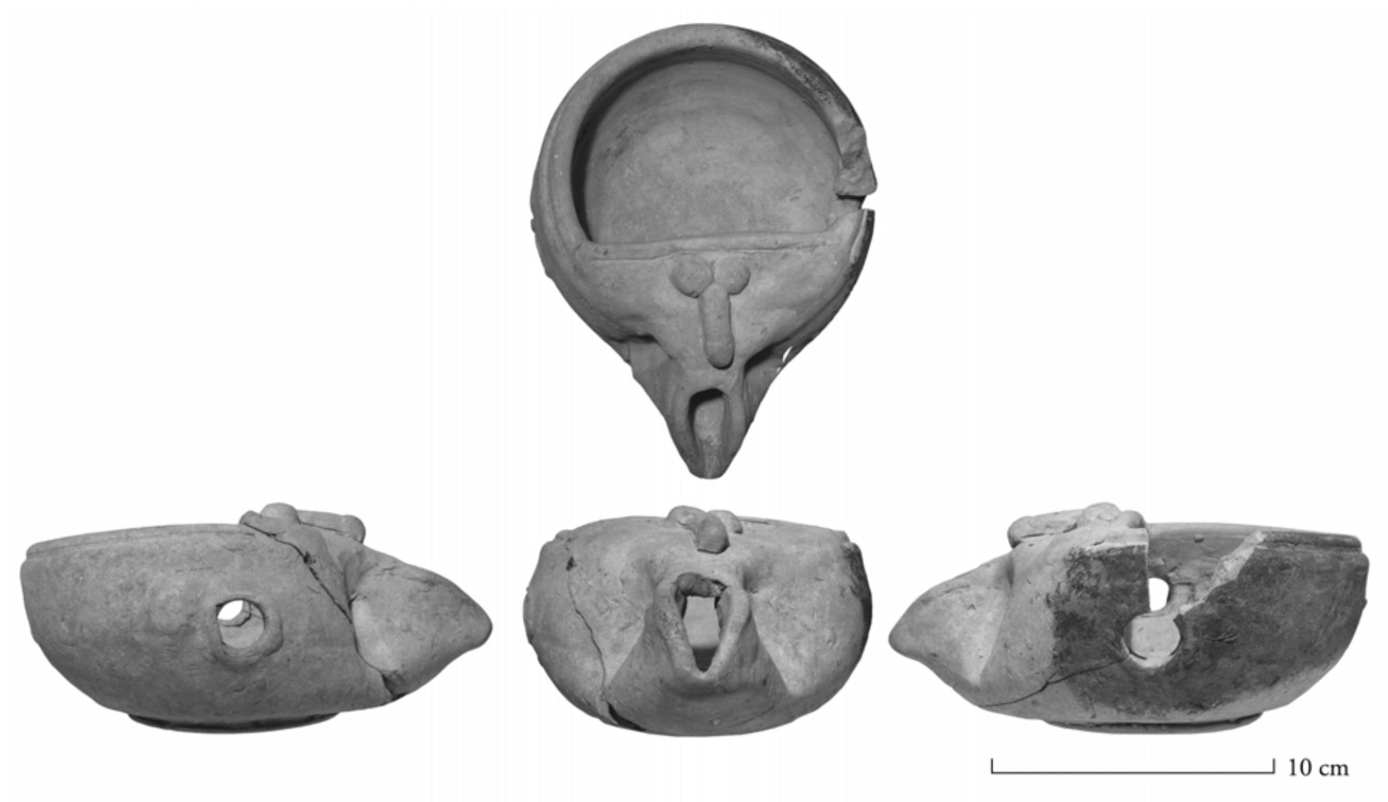 Terracotta lamp with a phallic motive.