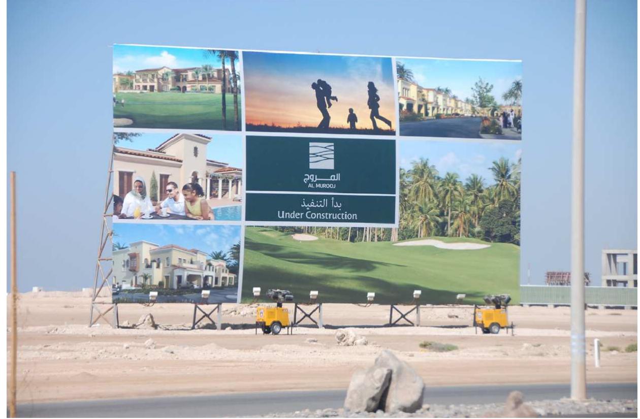 Billboard illustrates the high end villas, golf and ‘world