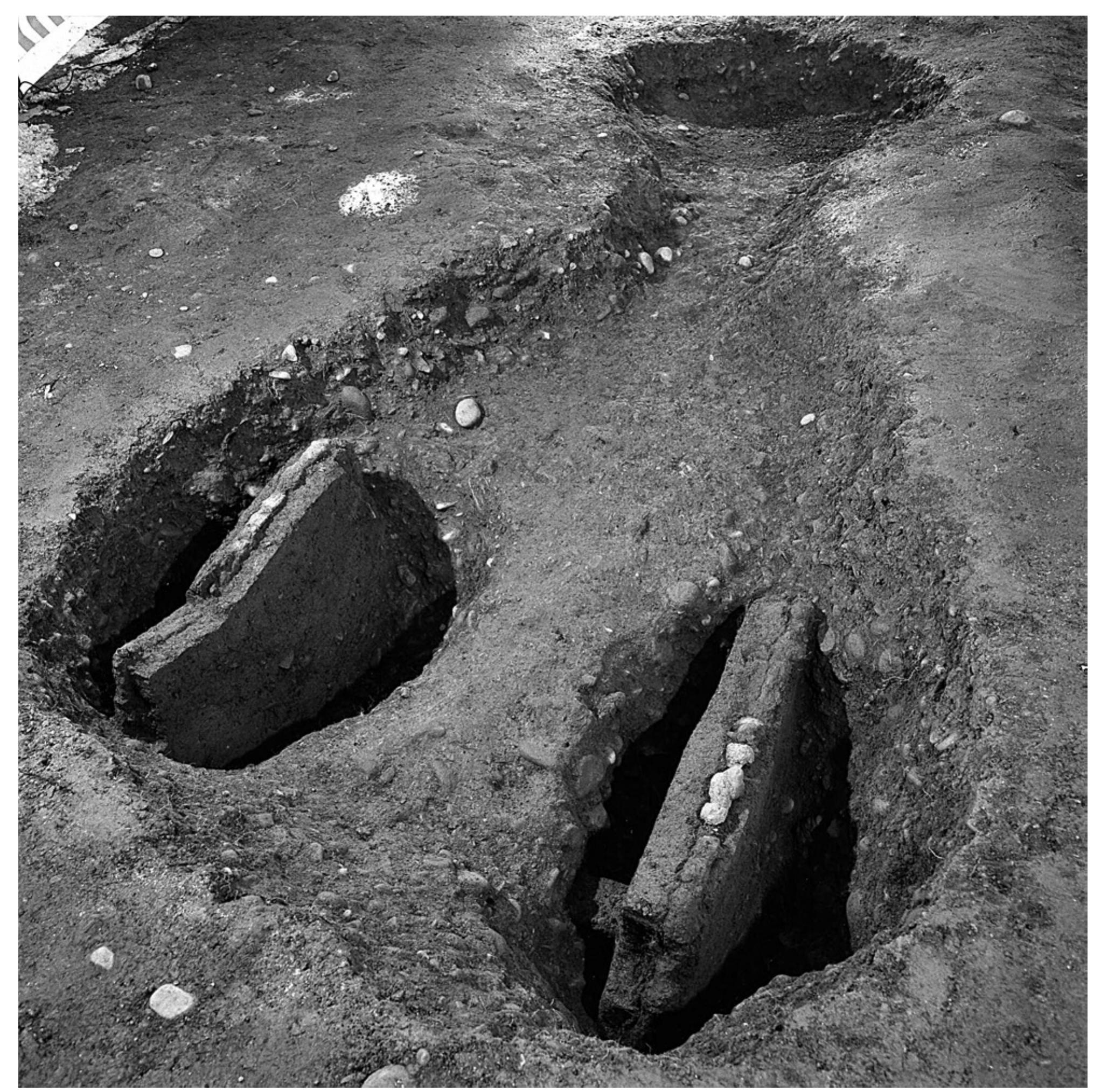 Oblique photograph of excavated burial pit showing intact