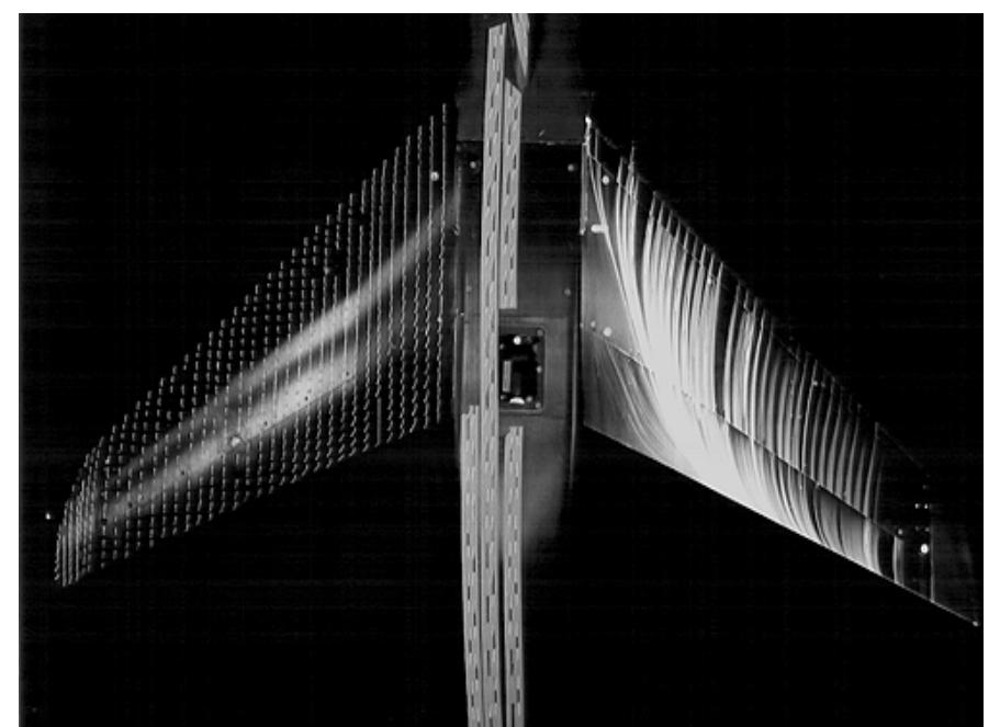The view below shows a wing in a wind tunnel with