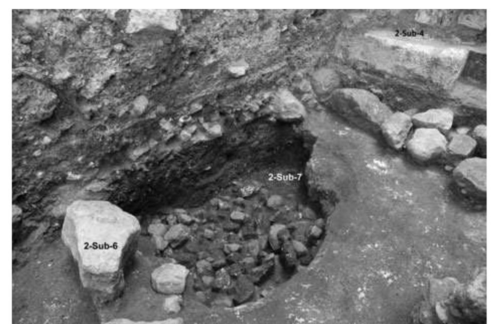 Photograph of large trash pit (2-sub-7) used for the