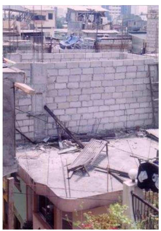 Concrete roof slab with protruding steel bars. (source: