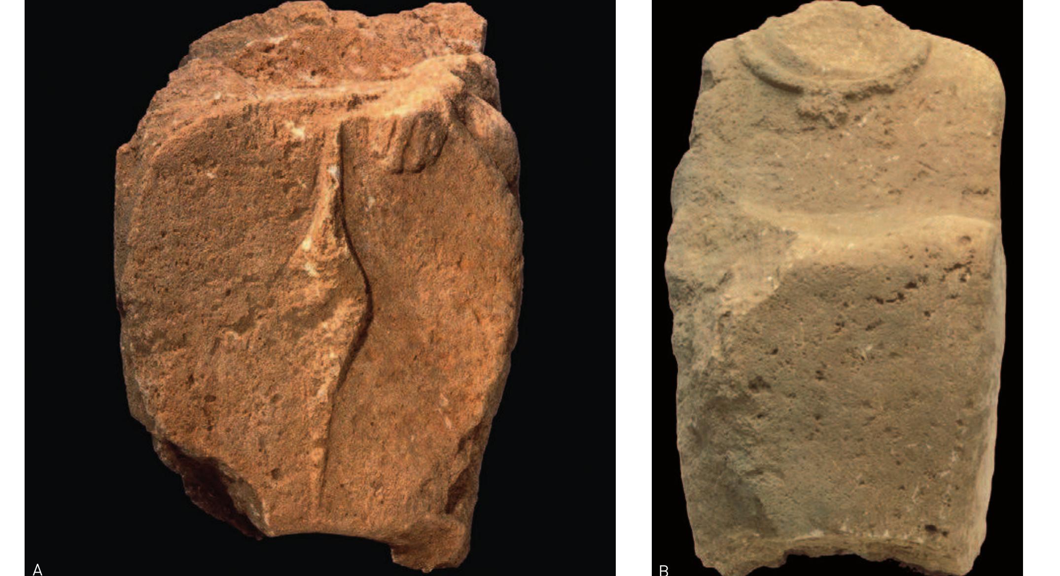 Mutilated stone sculptures of a man and a woman located at