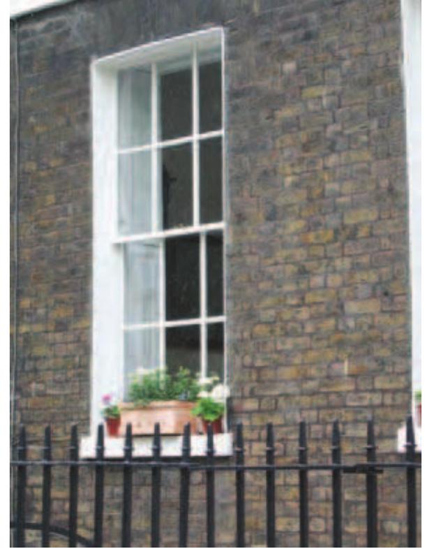 Timber window recessed from face of brickwork of georgian