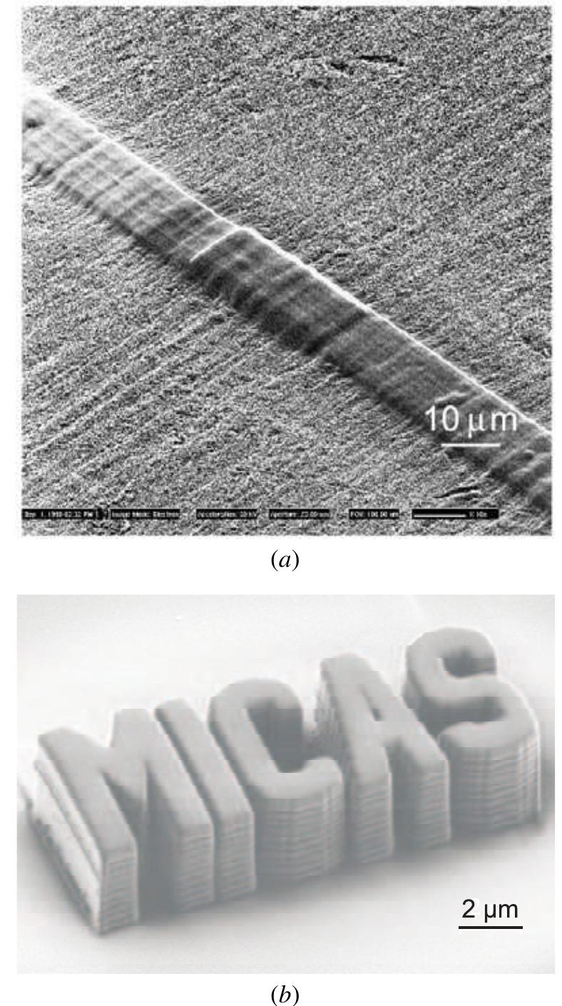 Deposition examples: (a) a 10 4m wide tungsten line on a