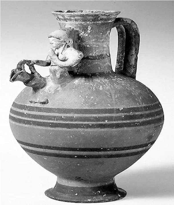 Late 6"—early 5"-century bichrome red ware jug with female