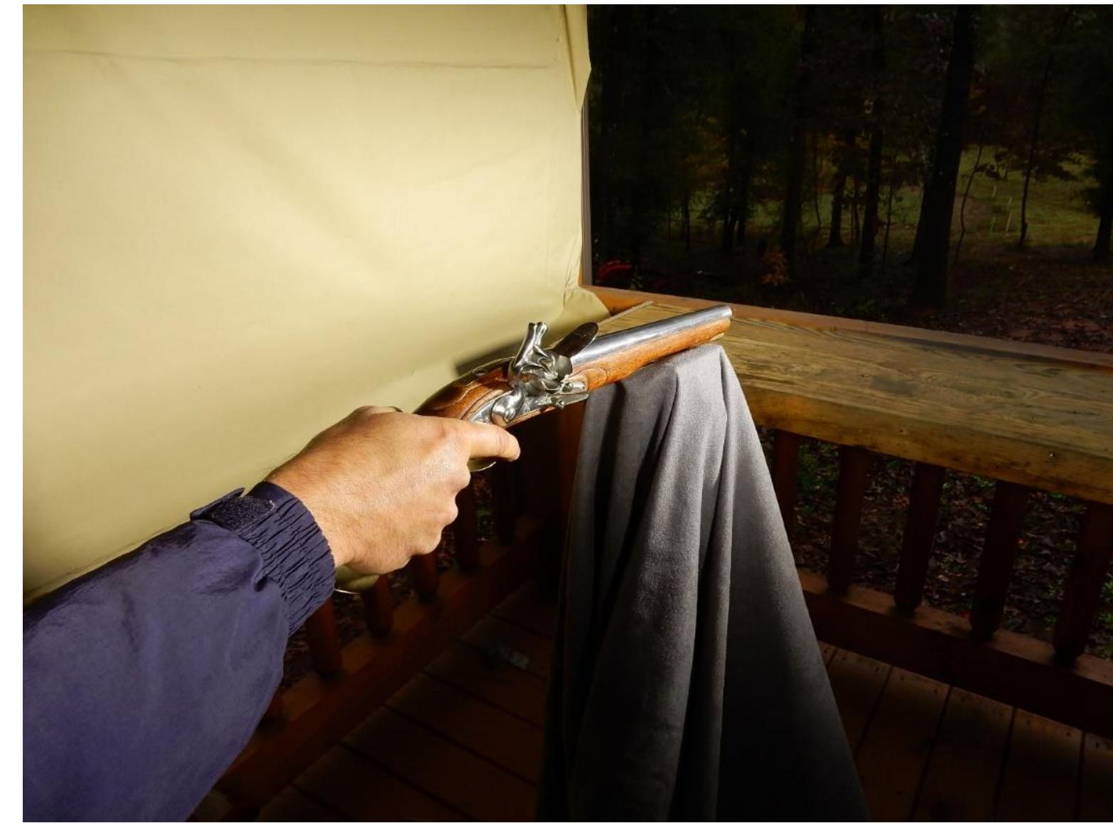 Flintlock dragoon pistol set for a shot.