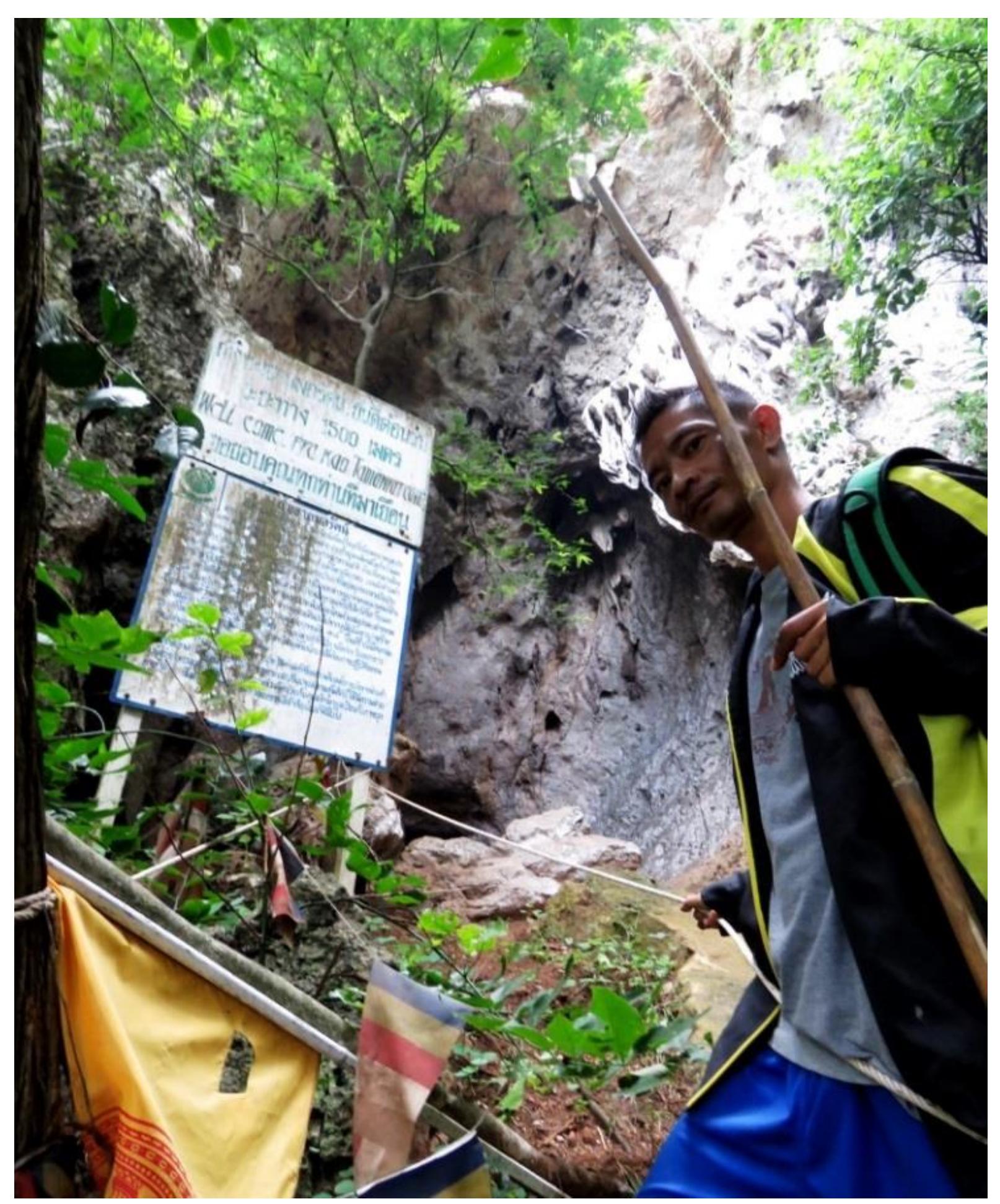 Sign and fixed ropes just below the cave entrance.