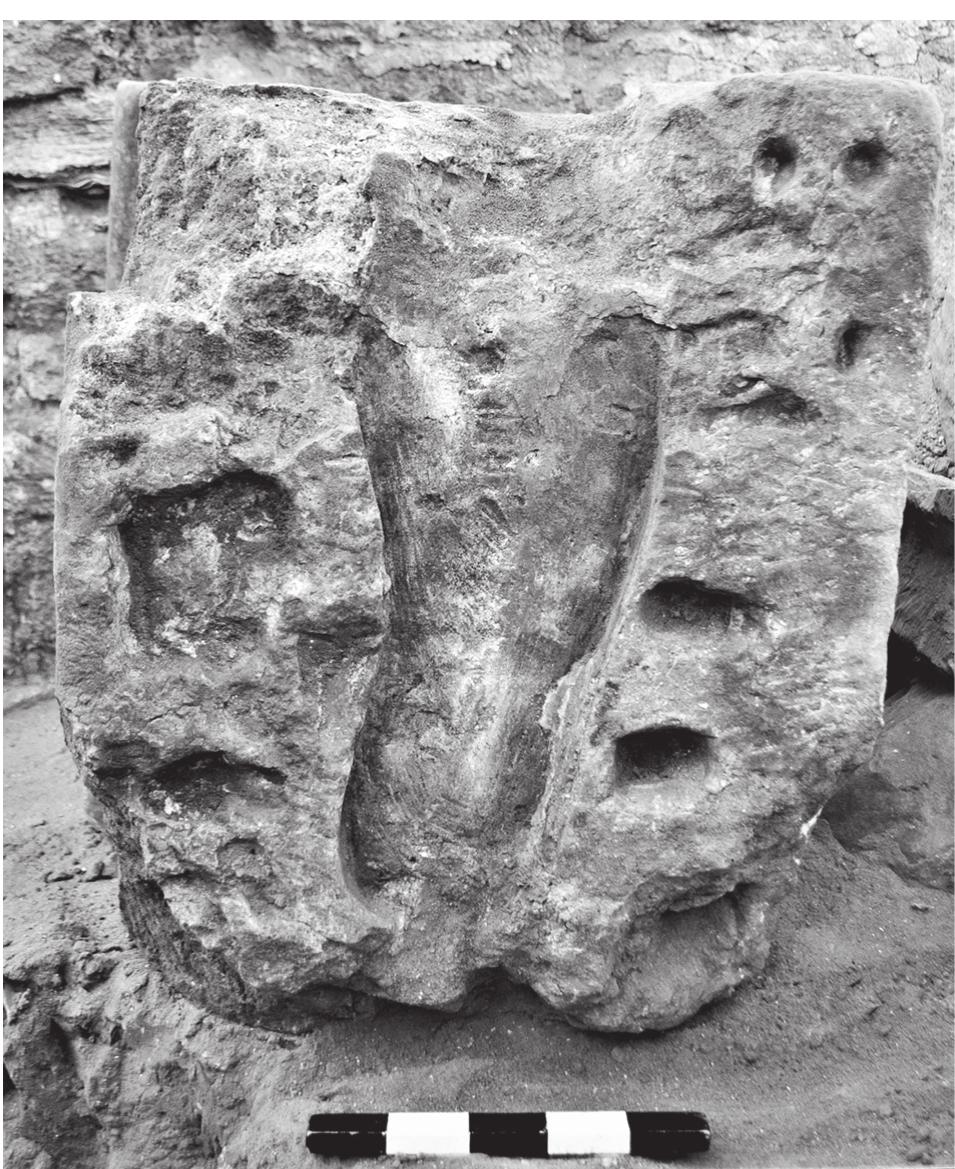 3: statue base depicting human foot: symbol of serapis.