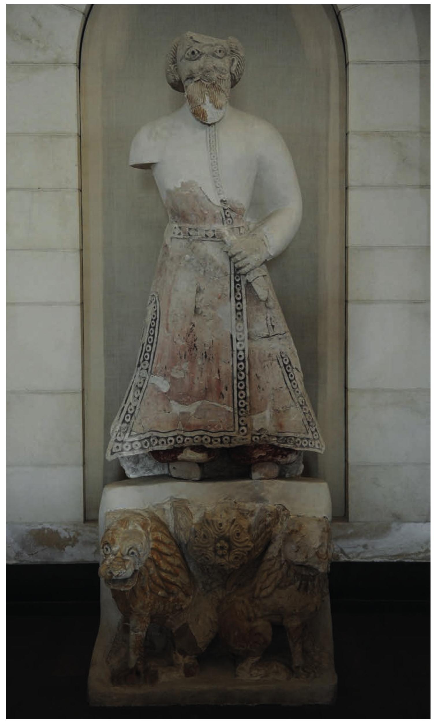Moulded plaster statue depicting a caliph standing above two