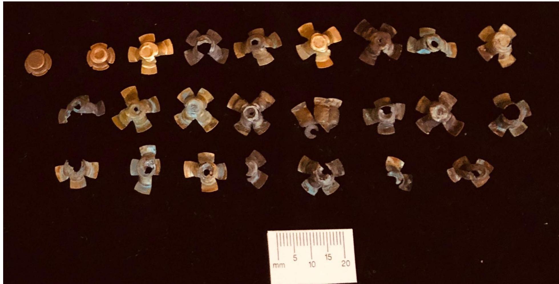 A series of unfired and fired musket caps from a modern live