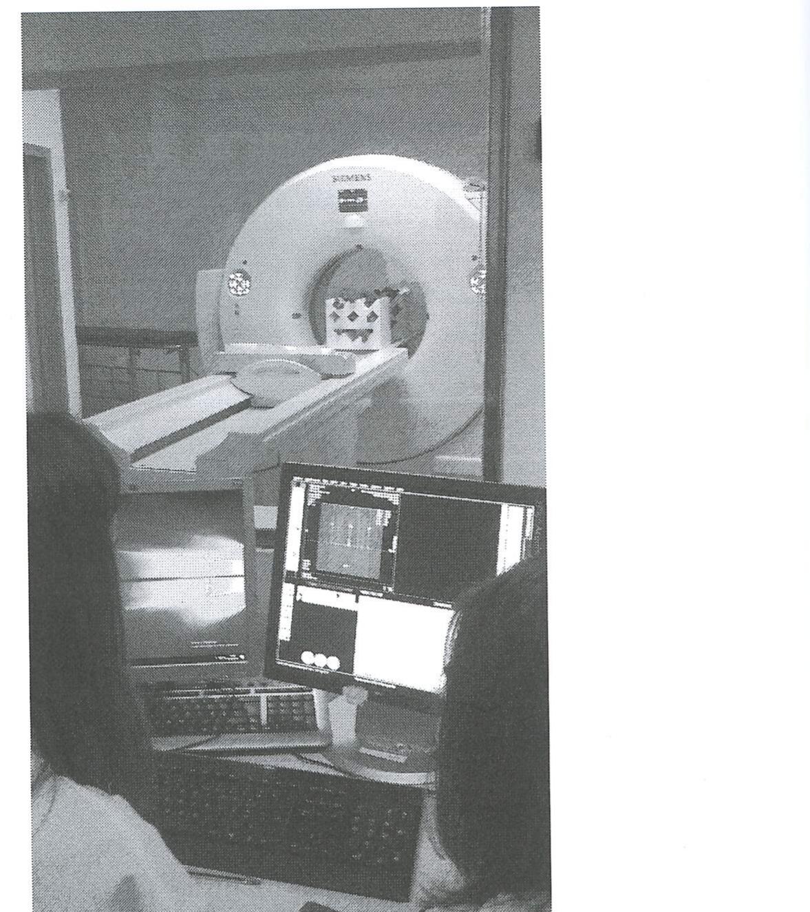2 two technicians conduct a ct scan of multiple objects