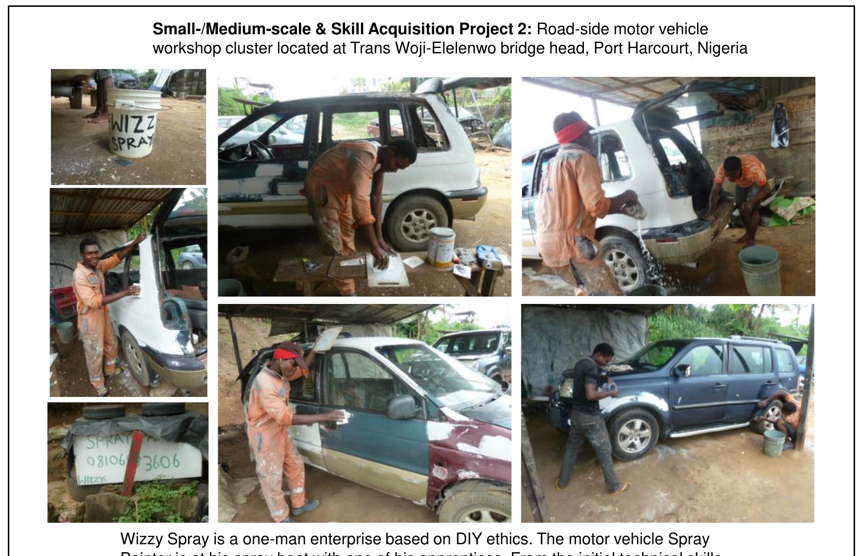 A motor vehicle spray painter with his apprentice at work.