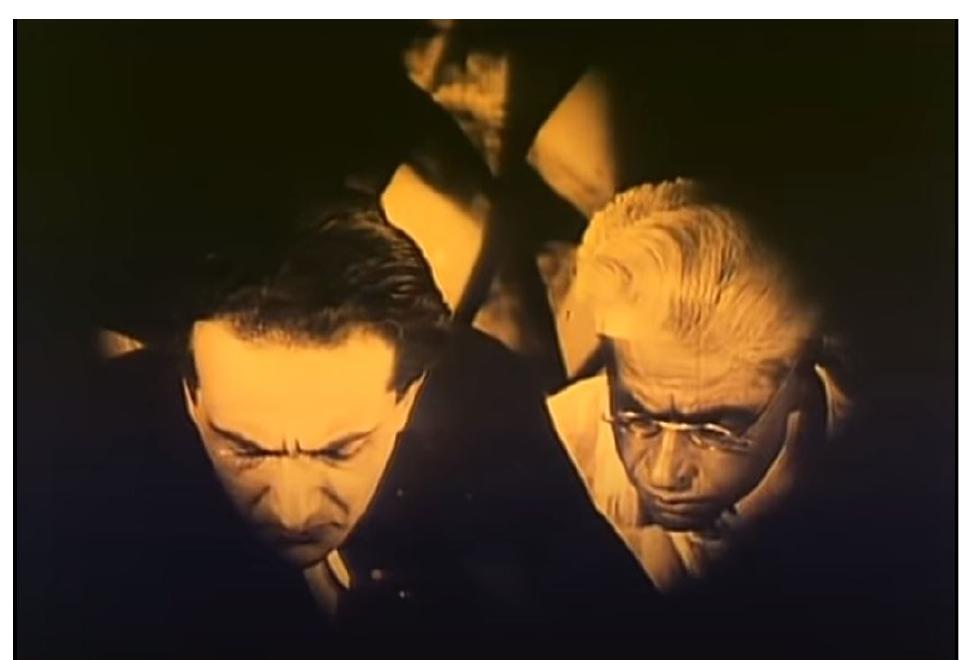 The camera pans left to right as francis and the doctors