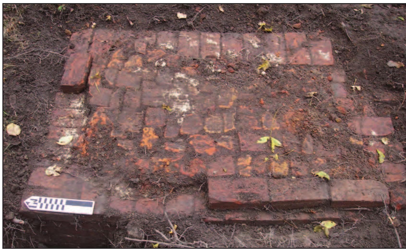 -7. _ base of the house’s main chimney encountered at ca.