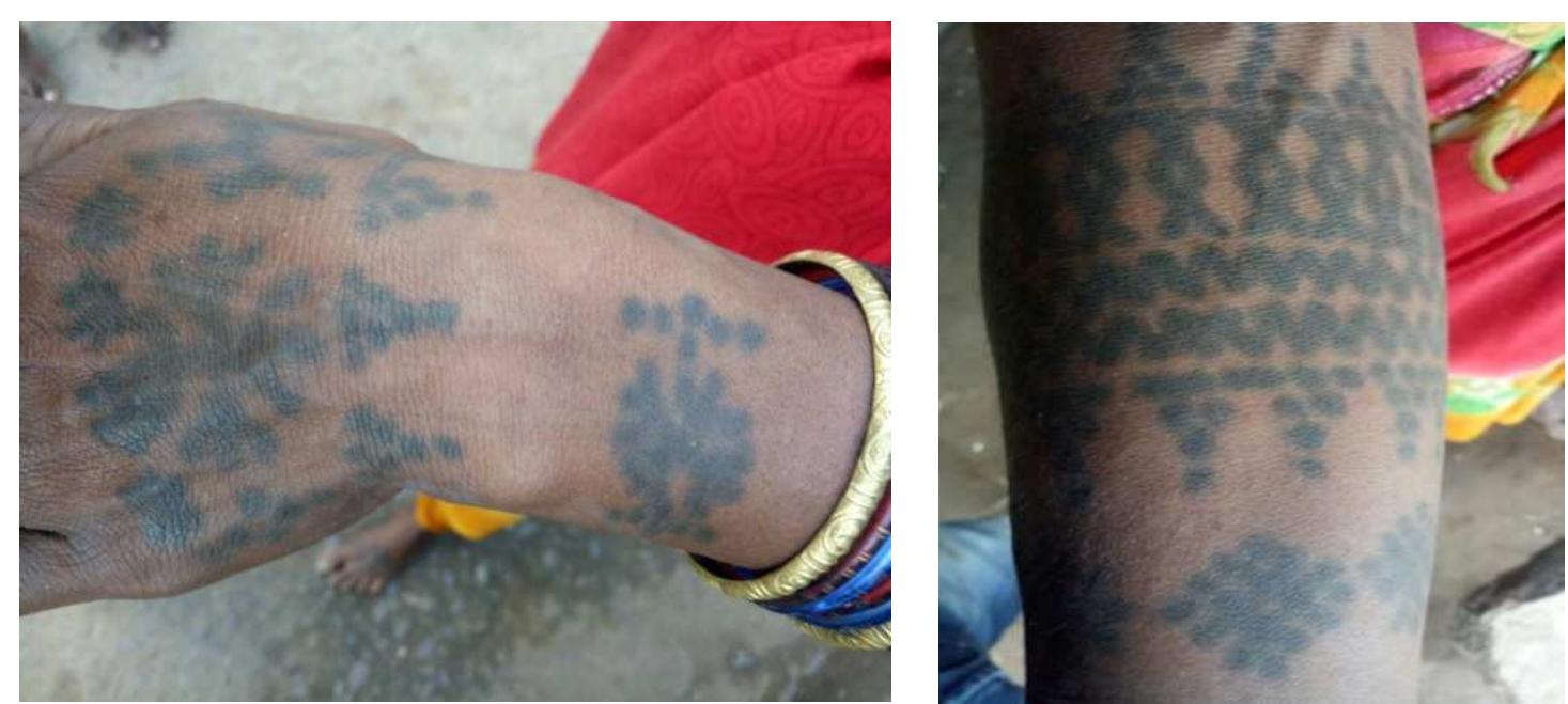 Traditional godna on hands of gond tribal lady